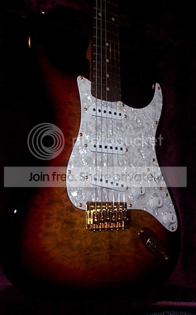 White pearloid pickguard-what color Strat/Tele? Show me pix if you have ...